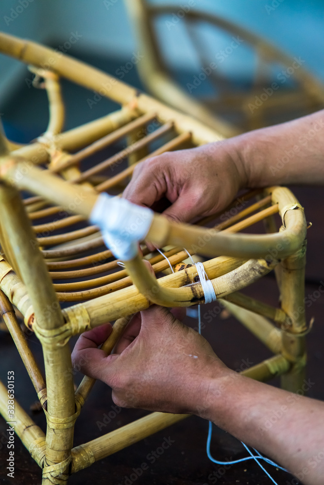 Restoration of rattan chair with white thread. Recycling, upcycling and ...