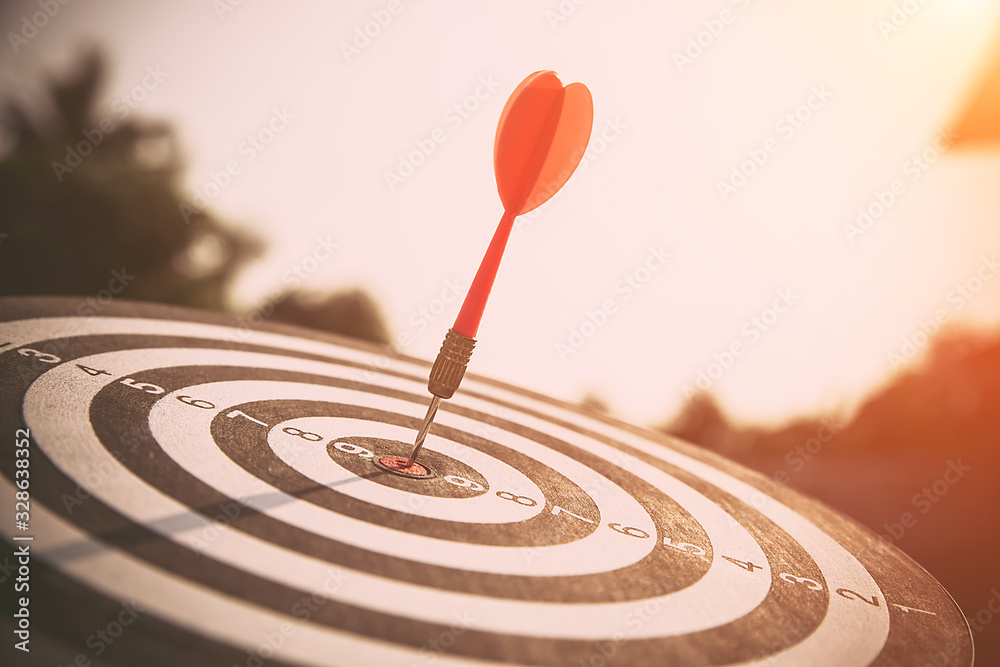 The bullseye, or bull's-eye or dart board has dart arrow hitting the ...
