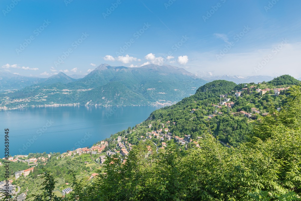 Large European lake seen from above. Lake Como, Italy with the village ...