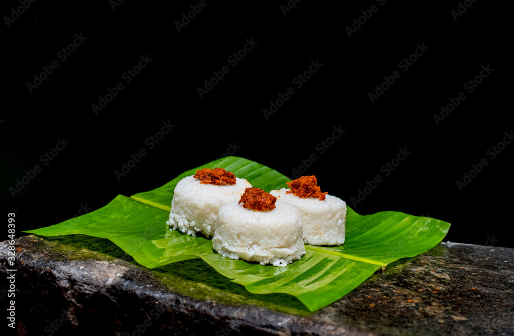 The milk rice on a banana leaf. Milk rice is a traditional Sri Lankan ...