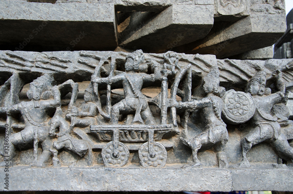 Carved idols on the outer wall of Hoysaleswara temple, is a 12th ...