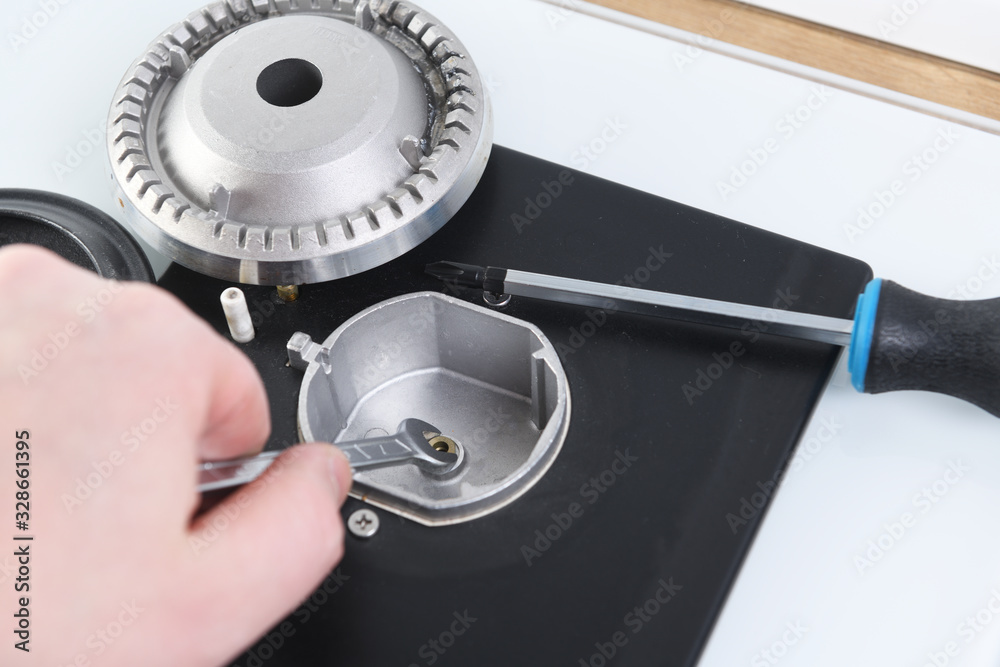 Repair of a gas burner on a glass hob.Gas Stove Repair & Services.Gas ...