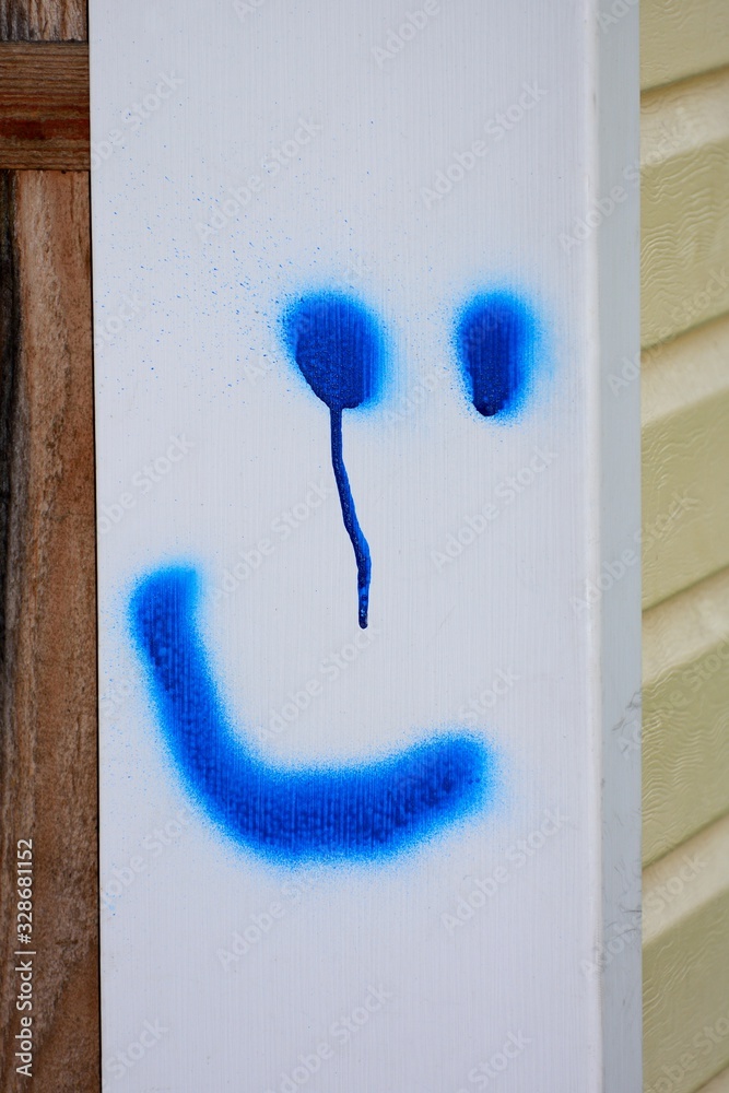 Crying smiley face painted with paint Stock Photo | Adobe Stock