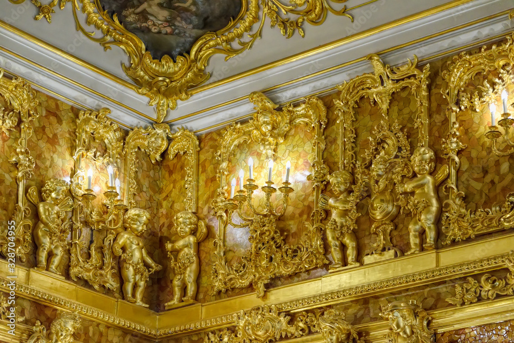 Gilded decorative elements on the amber wall of the newly renovated ...