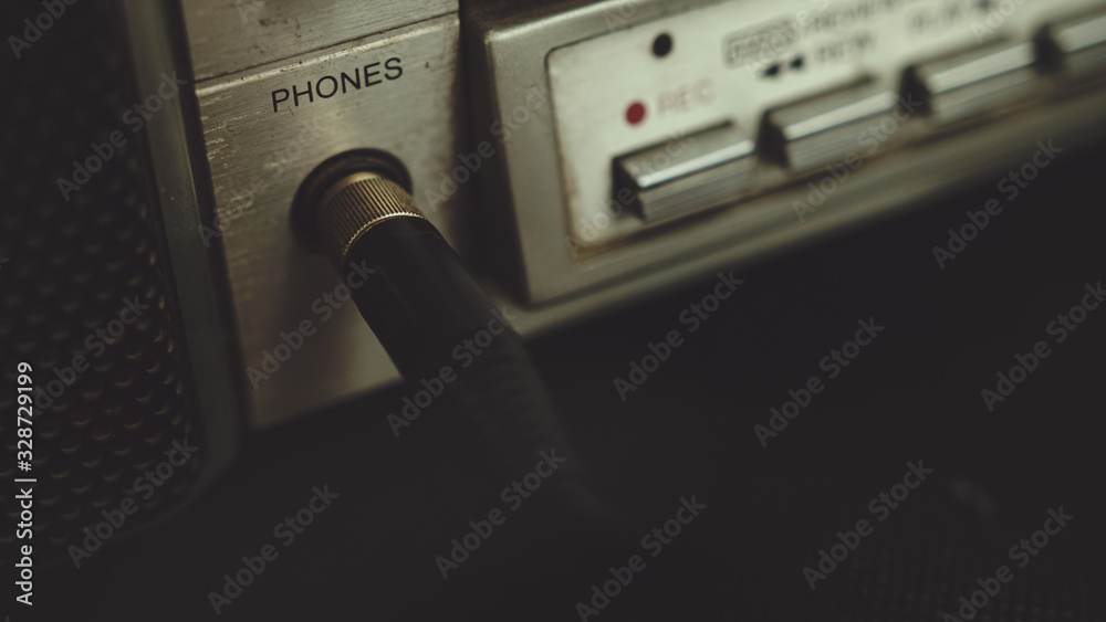 The old cassette player boombox headphone jack plugs into a headphone ...