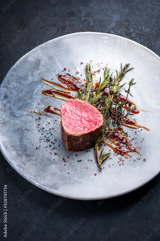 Barbecue dry aged beef fillet medallion steak natural with fried herbs ...