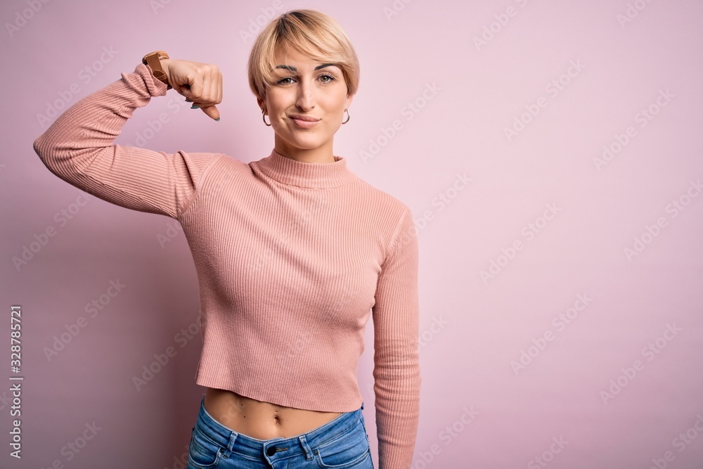 Young blonde woman with short hair wearing casual turtleneck sweater ...