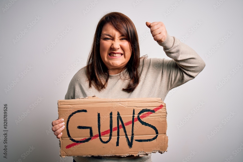 Plus size woman holding stop guns cardboard banner warning about ...