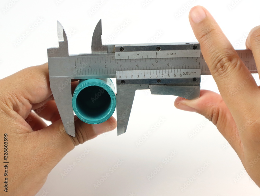 Measuring external dimensions of parts with vernier calipers. Stock ...