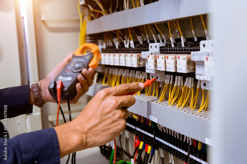Electrician measurements with multimeter testing current electric in ...