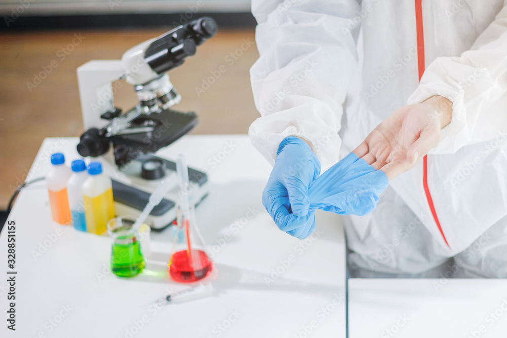 Medical scientists are wearing coronavirus protective clothing and ...