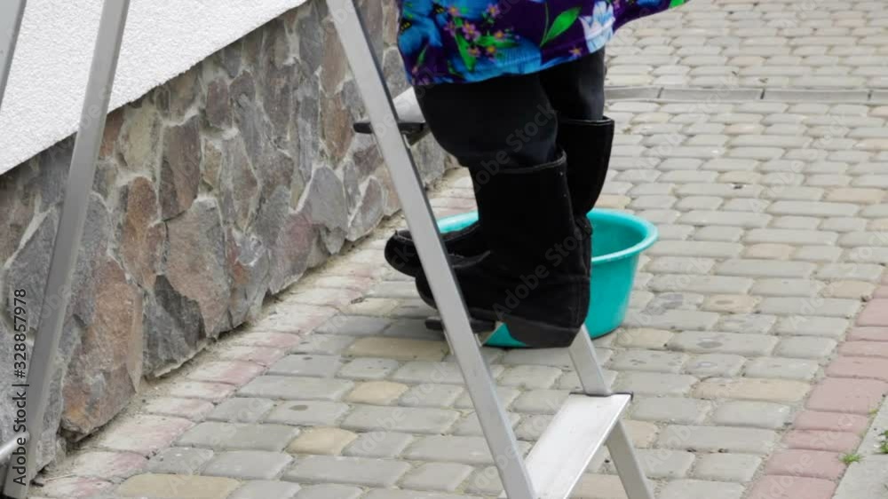 grandmother climbs the ladder,Grandmother's legs are stepping on a ...