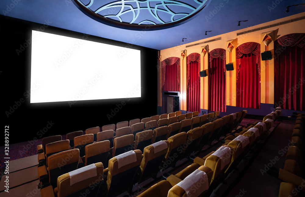 Cinema theater screen in front of seat rows in movie theater showing ...