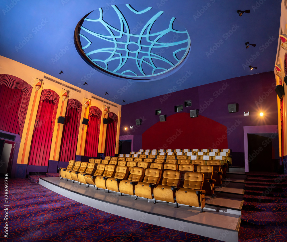 Large cinema theater interior with seat rows for audience to sit in ...