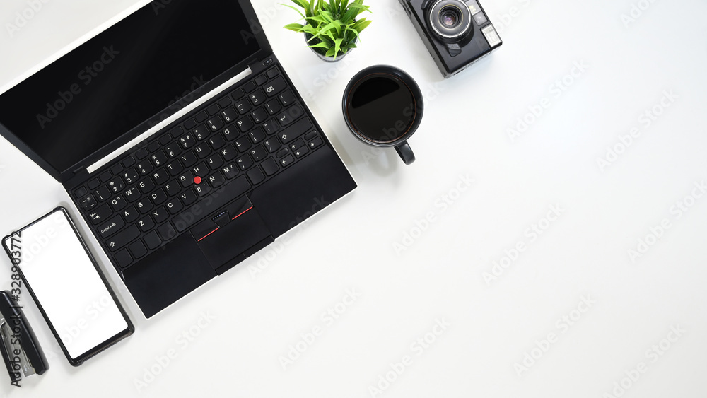 Top view image of Black computer laptop putting on white table with ...