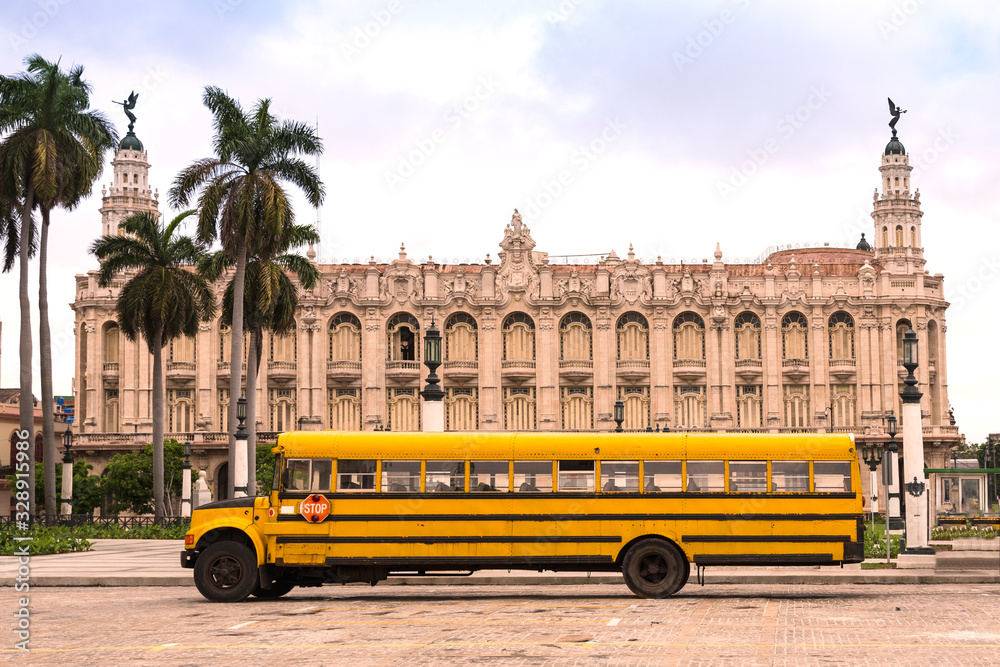 old yellow school bus in front of the grand theatre in havana cuba ...