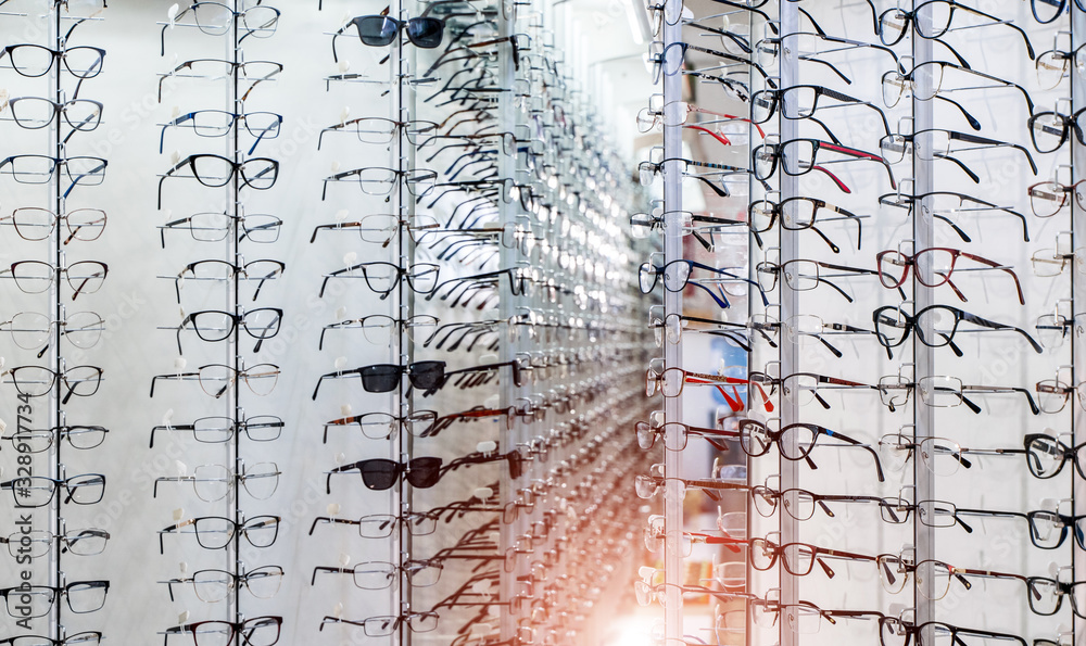 Showcase with spectacles in modern ophthalmic store. Closeup. Stock ...
