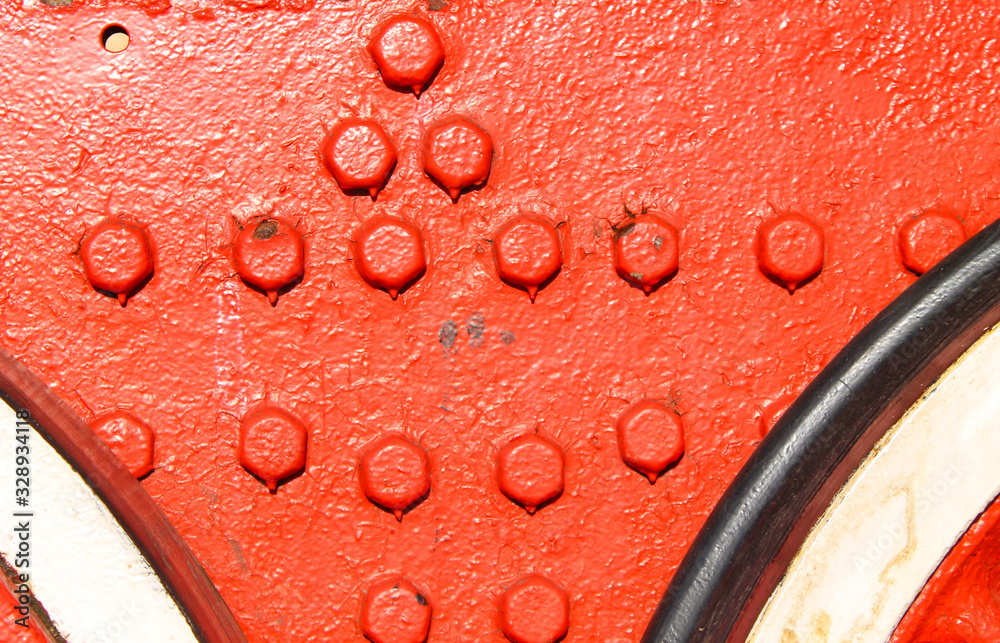 Old steam train wheels. Red background horizontal metal texture with ...