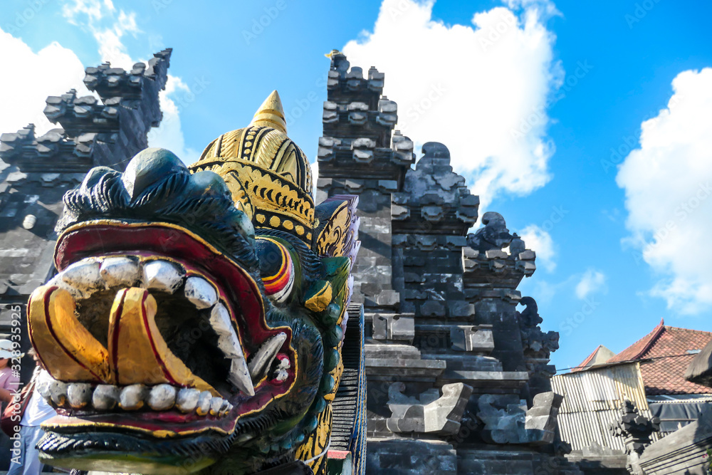 A colourful dragon wearing a crown at entrance gate to Tanah Lot temple ...