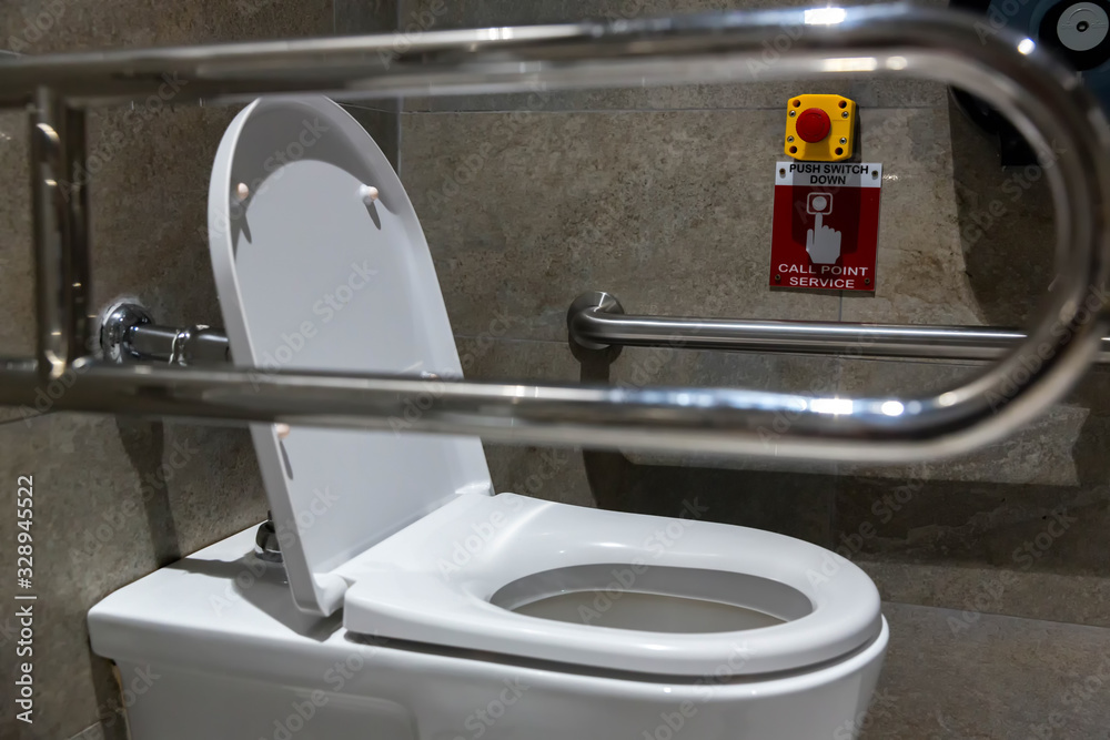 Public disabled toilet in a large building. Modern restroom for ...