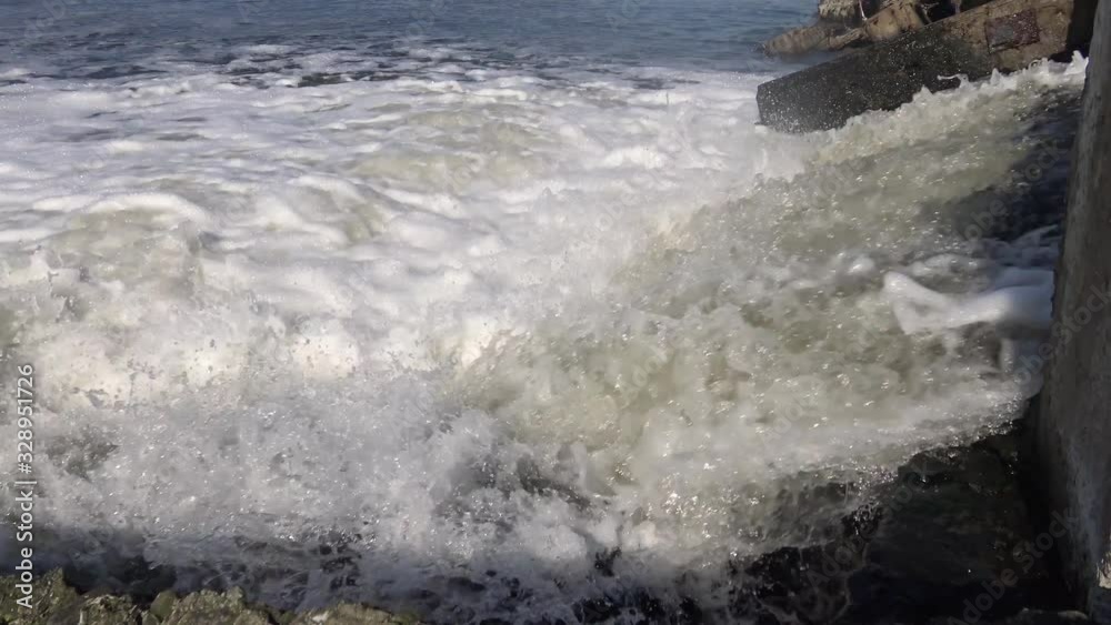Water pollution. Dirty water from treatment plants flows through a pipe ...