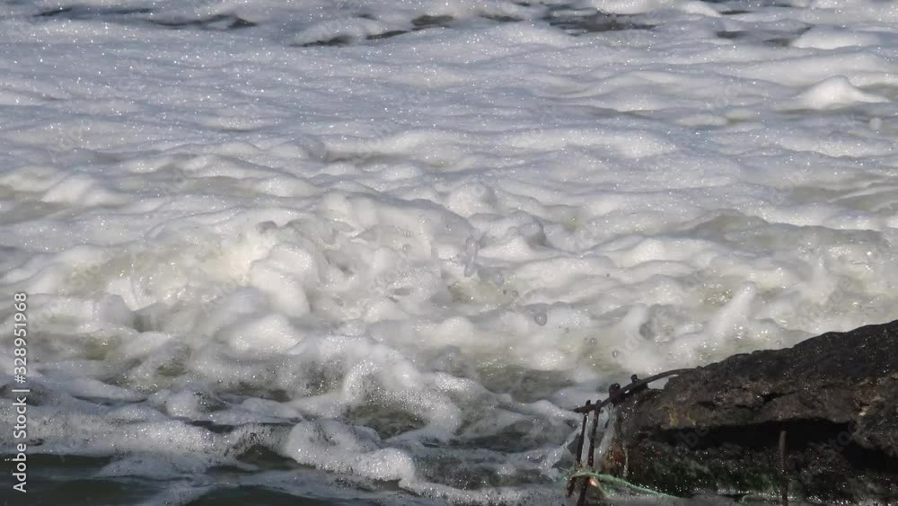 Water pollution. Dirty water from treatment plants flows through a pipe ...