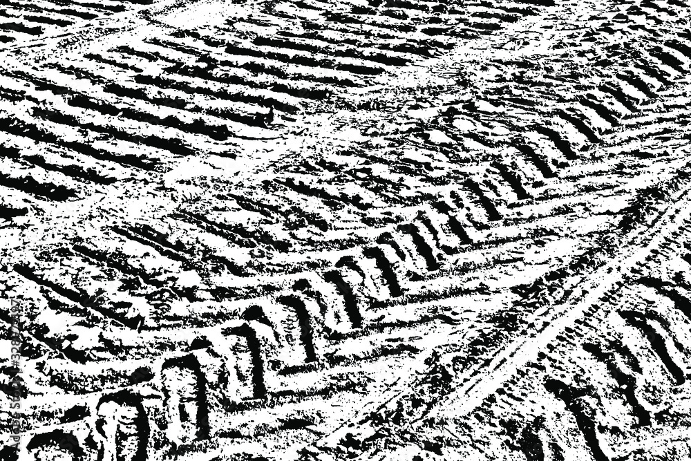 Grunge texture of vehicle tire tracks. Monochrome background of traces ...