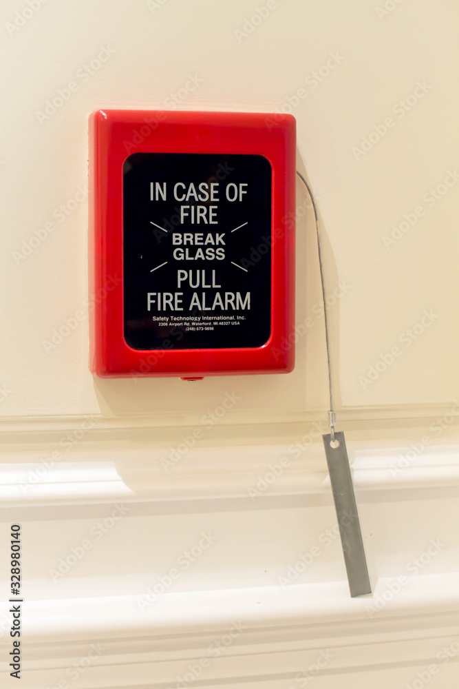 Fire alarm box with glass breaker Stock Photo | Adobe Stock