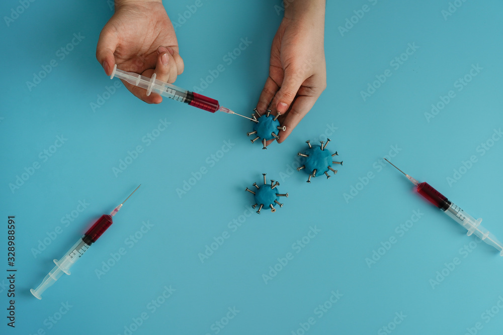 Diseased and recovery concept, two syringes with red liquid and three ...