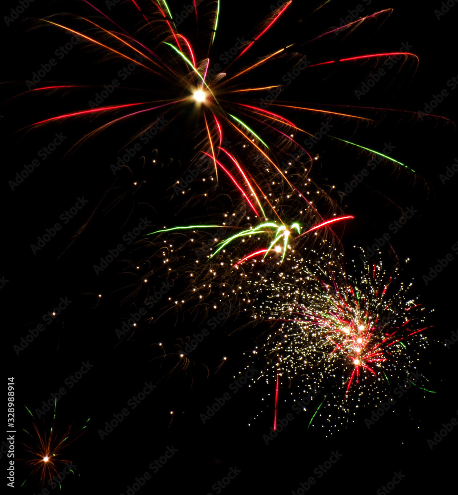 Explosions of fireworks in the sky. Multicolored sparks from the ...