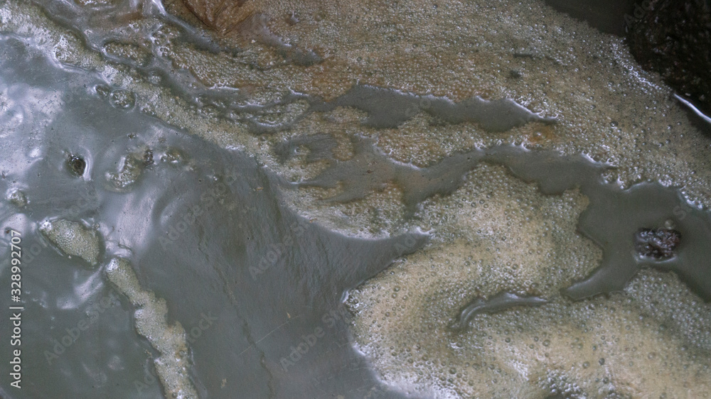 Scum bubbles floating on a surface of polluted water Stock Photo ...