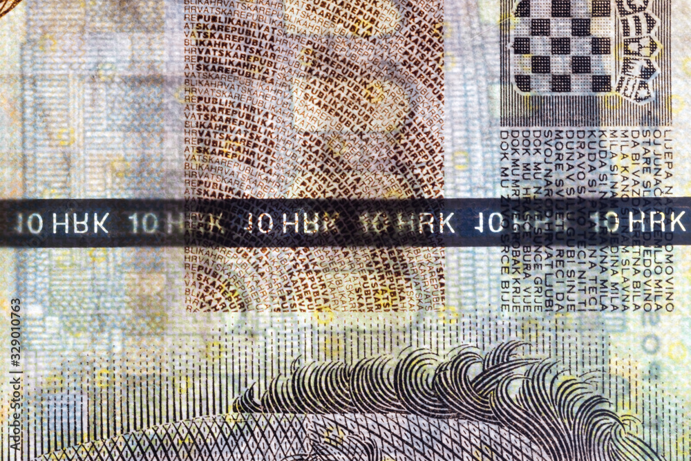 Plastic security strip inside 10 HRK banknote. Security strip on ...