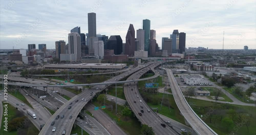 This video is about an aerial of traffic on freeway near downtown ...