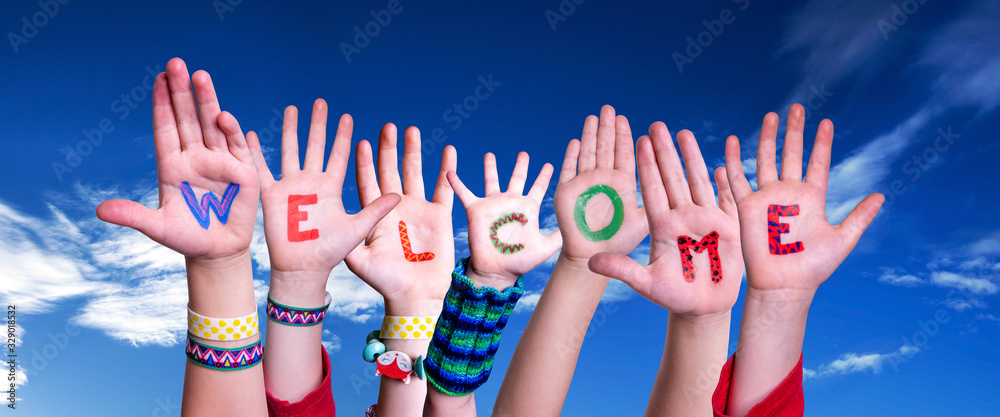 Many Children Hands Building Colorful Word Welcome. Blue Sky As ...