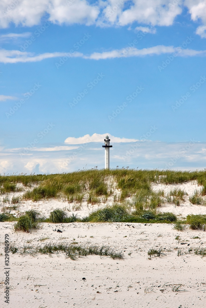 Dueodde Lighthouse (Dueodde Fyr) built in 1962 seen over sand dunes ...