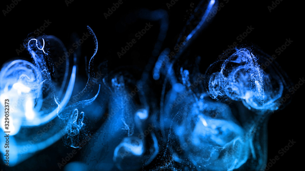 injection of blue fluorescent ink in water isolated on black background ...