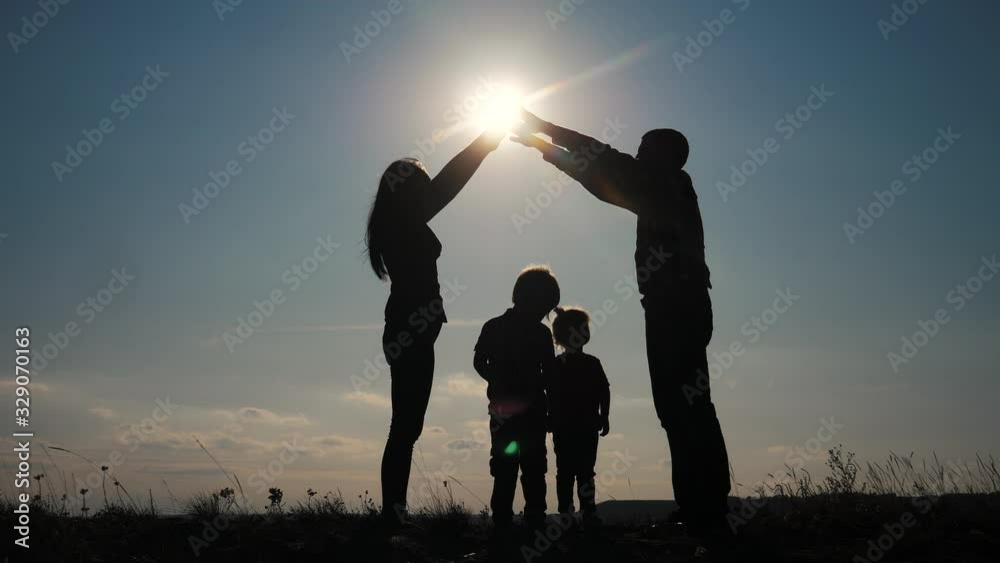 happy family teamwork silhouette shows a house and comfort symbol at ...