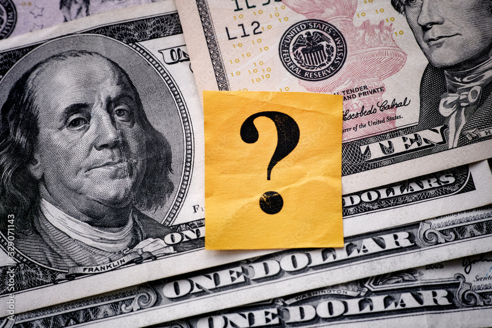 Yellow paper note with question mark on US dollar background Stock ...