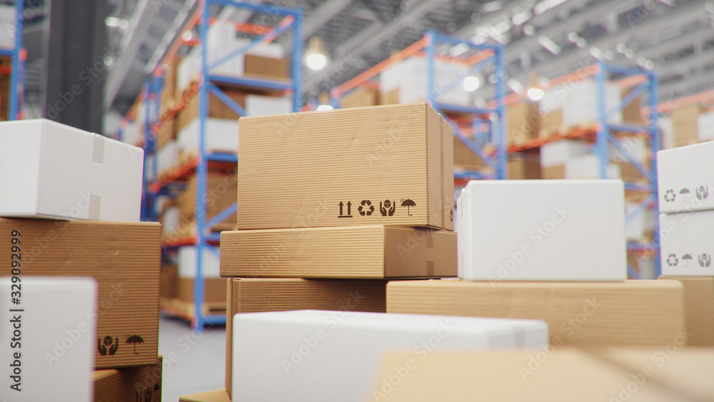 Cardboard boxes in middle of the warehouse, logistic center. Huge ...
