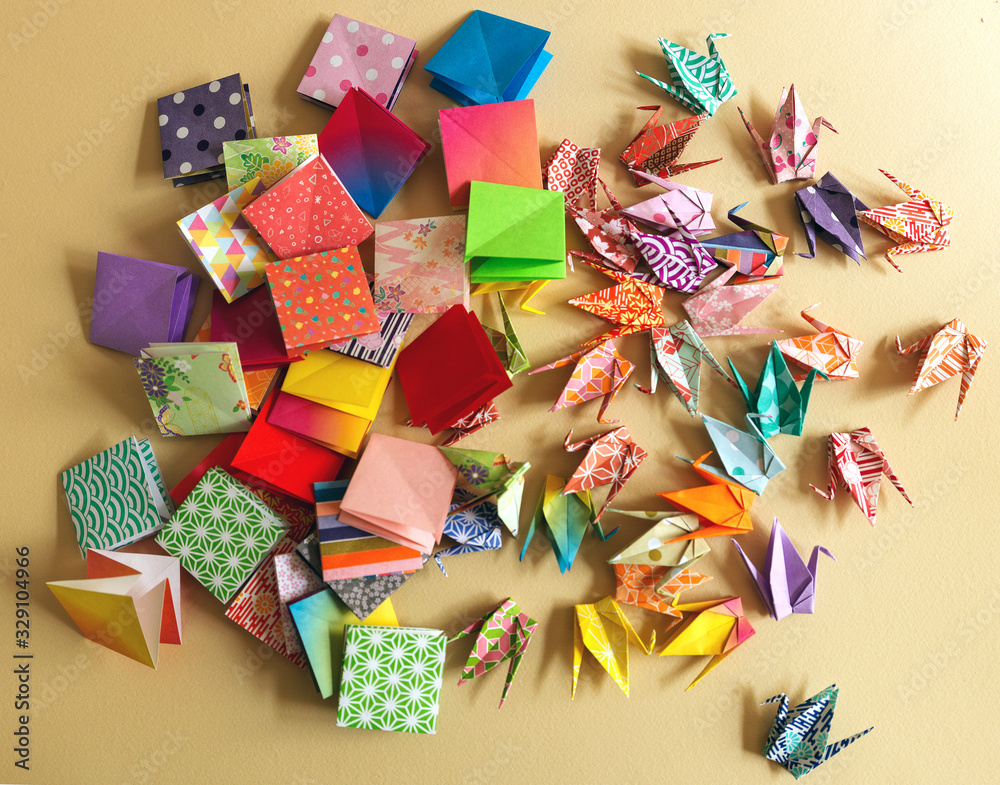 Origami is the art of paper folding, which is often associated with ...