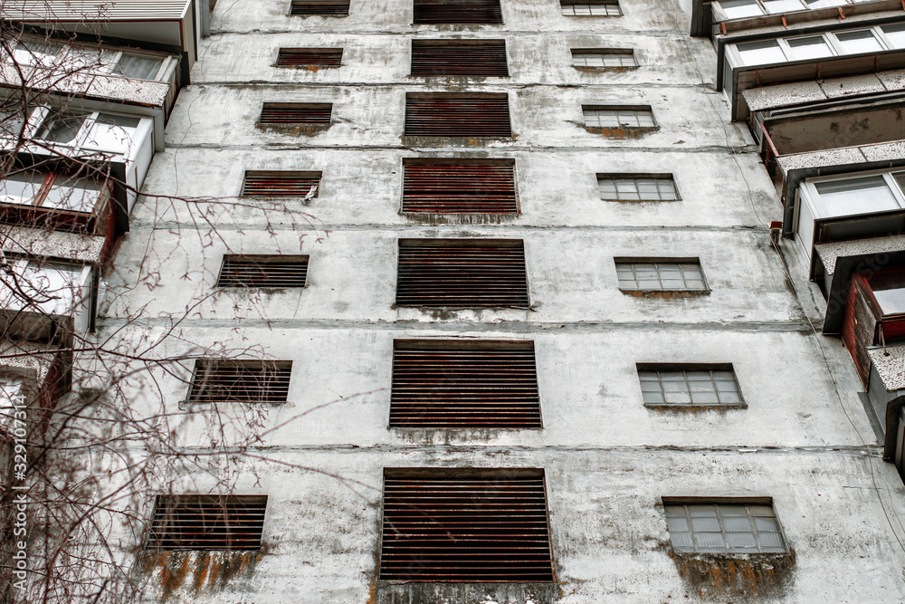 Bottom view of an old multi-storey building. Old residential building ...