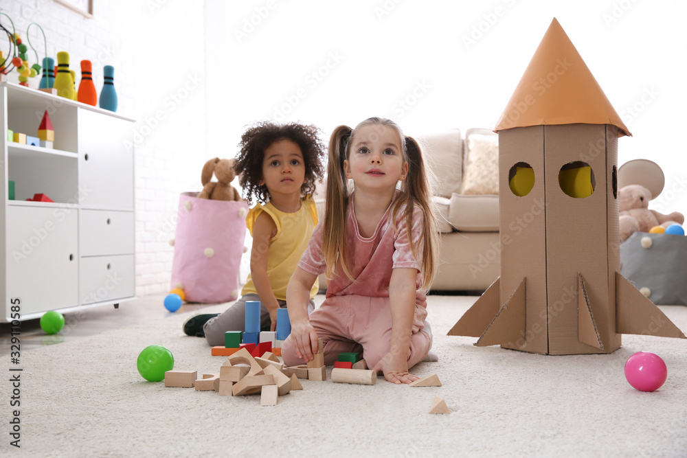 Cute little children playing with blocks at home Stock Photo | Adobe Stock