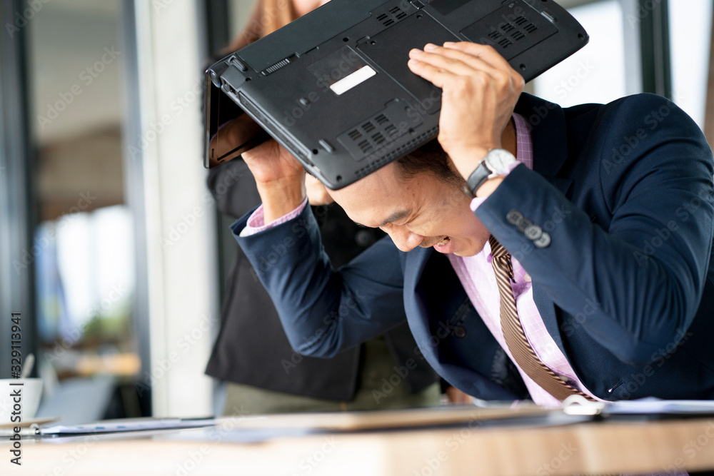 Strained businessman looks grave and so stressful with his working plan ...
