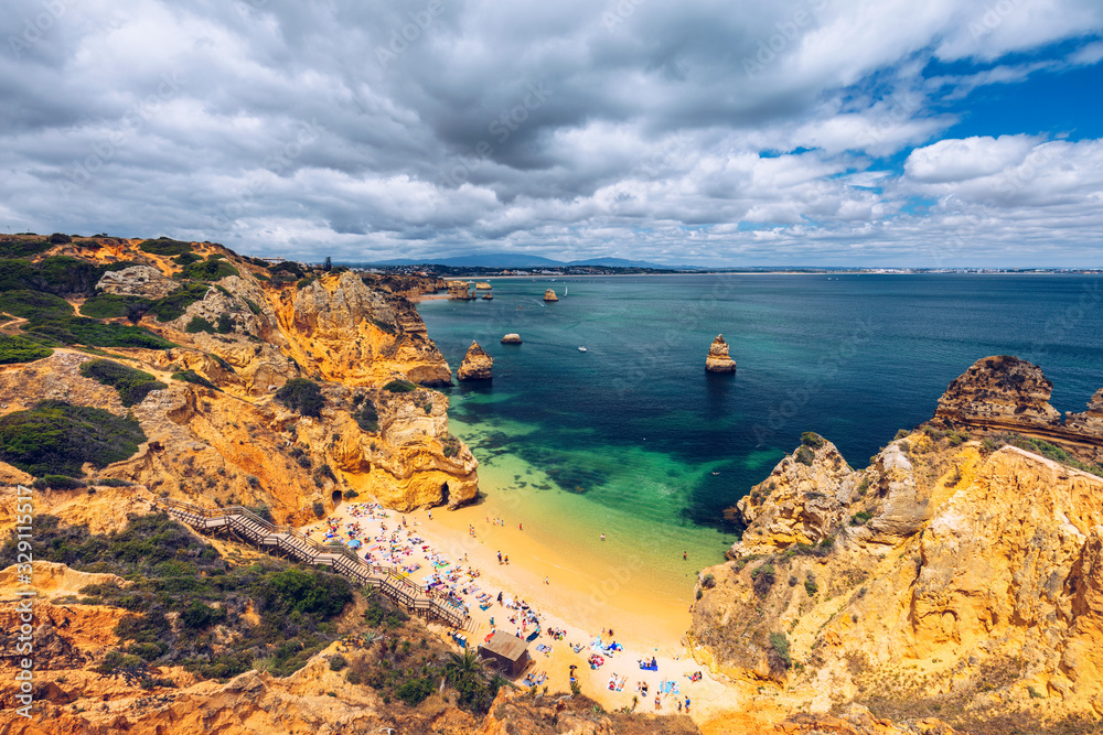 Camilo beach (Praia do Camilo) in Lagos, Algarve, Portugal. Wooden ...