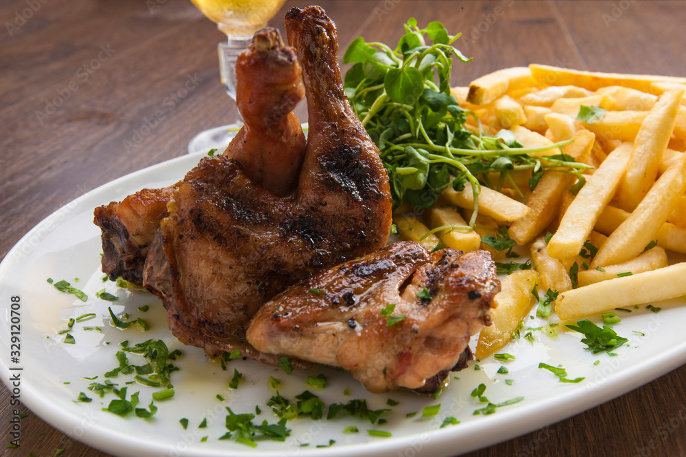 churrasco de frango com batatas fritas Stock Photo | Adobe Stock