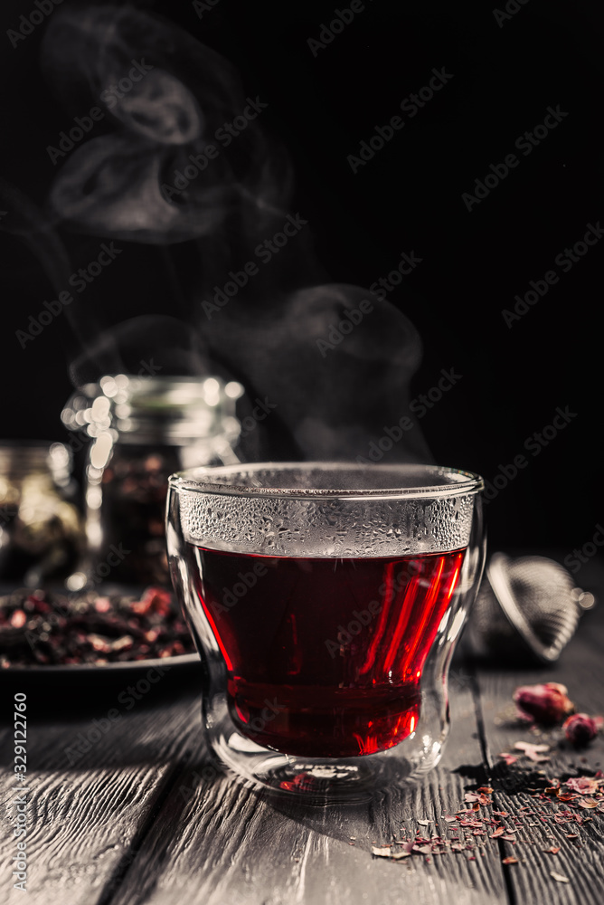 Cup of freshly brewed red karkade tea,rose tea ceremony, dark moody.Hot ...