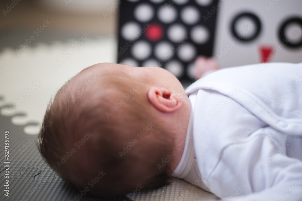 Baby watching Infant Vision Development contrast cards on a playmat, 1 ...