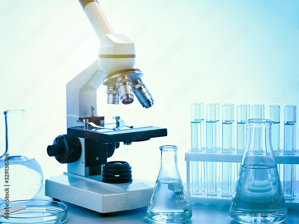 Microscope with test tubes and laboratory glassware. Stock Photo ...