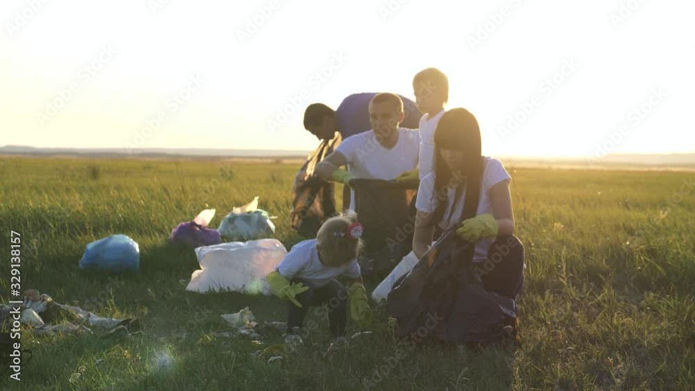 A large family voluntarily collects garbage, plastic and paper waste ...