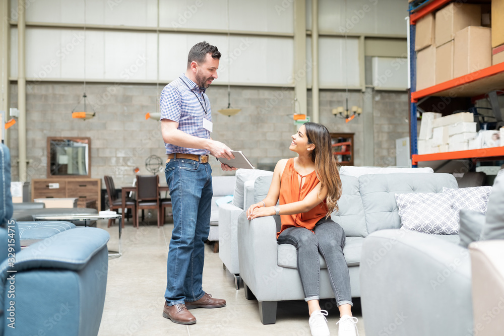 Salesman Talking With Beautiful Female Customer At Store Stock Photo ...